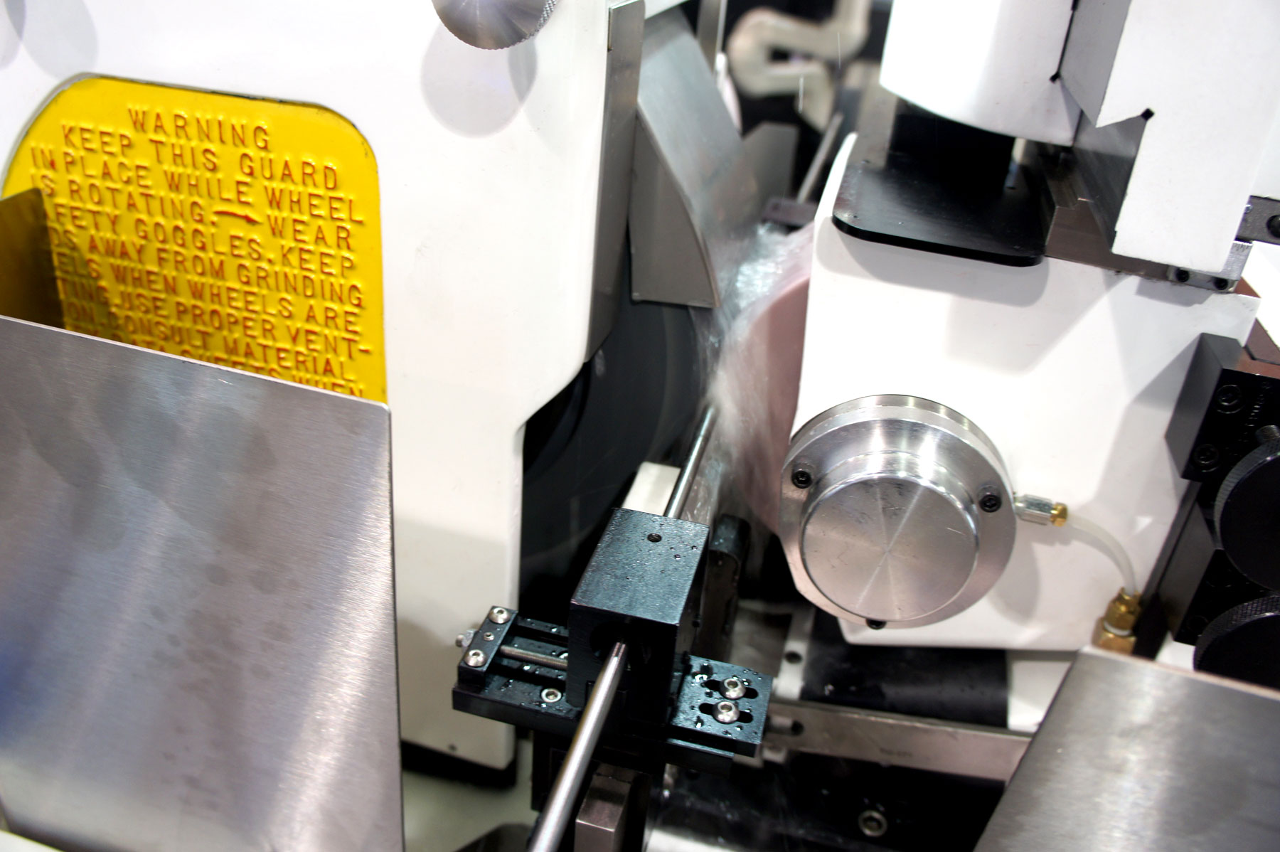 Infeed Grinding Segments on a NITI Tube - Royal Master Grinders